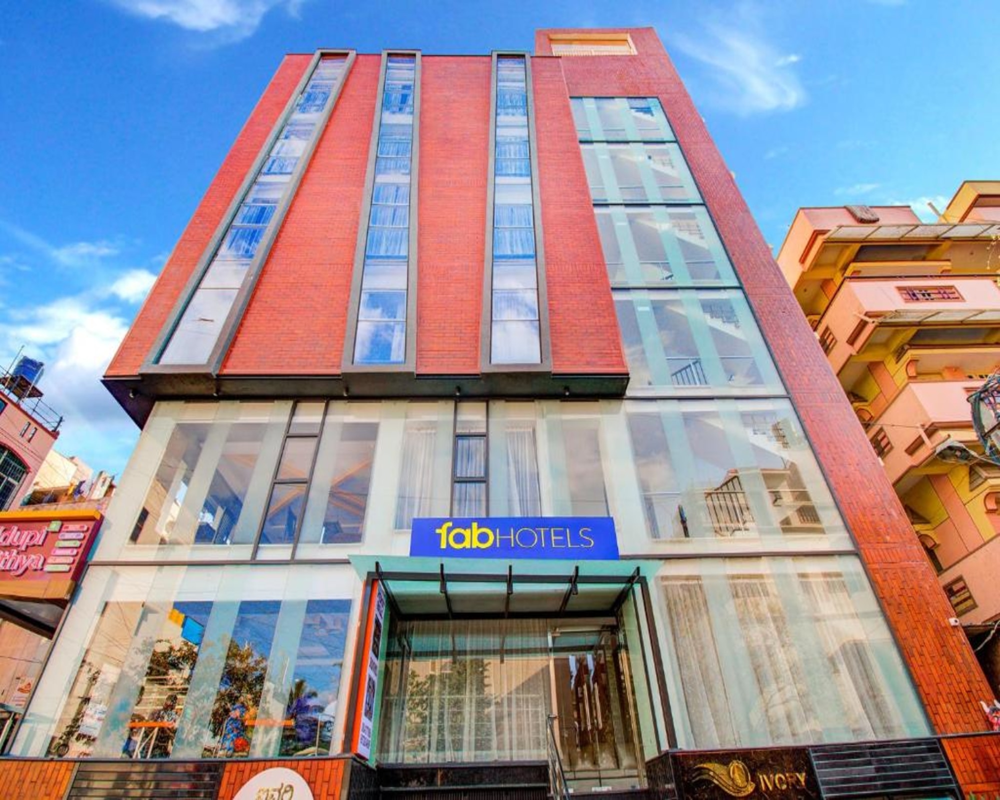 Rooms of FabHotel The Royal Suites - Nr. Gopalan innovation mall ...